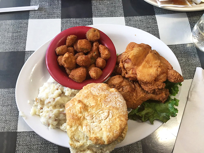 Those crispy okra nuggets aren't just a side dish – they're little Southern flavor bombs delivering crunch alongside the main event of chicken and potatoes.