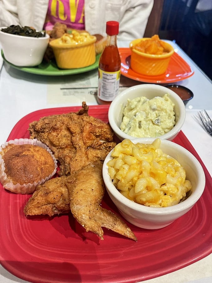 A plate that answers the eternal question: "What does joy look like?" Crispy chicken, creamy mac and cheese, and cornbread&mdash;that's what.