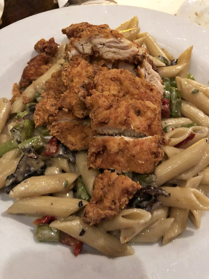 Crispy chicken meets creamy pasta in this dish that's like the culinary equivalent of finding money in your winter coat pocket. 