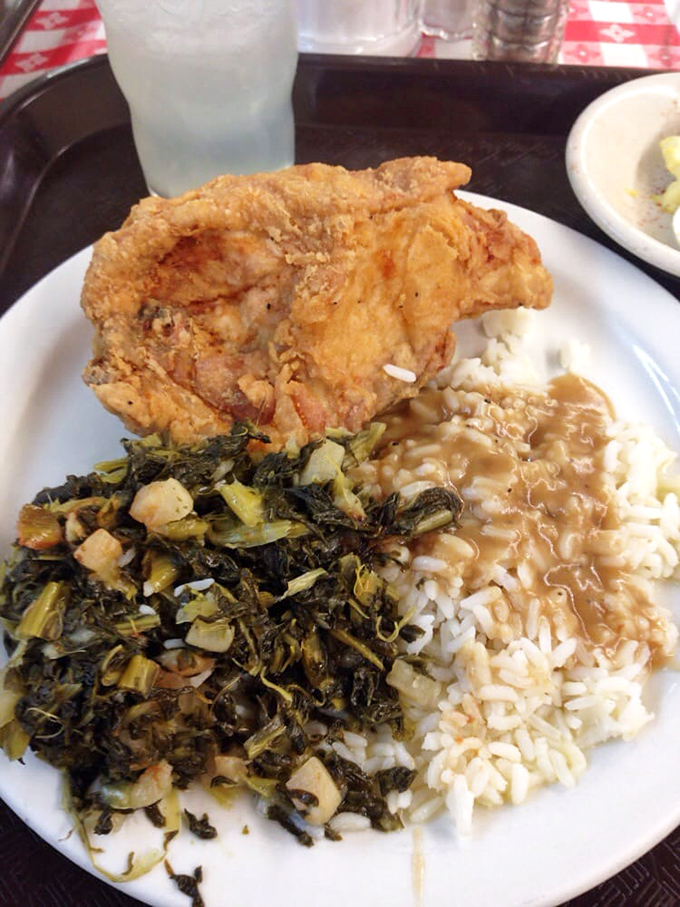 This isn't just lunch &ndash; it's a Southern passport stamped with crispy chicken, collard redemption, and rice awaiting gravy's warm embrace.