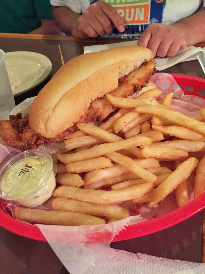 This isn't just a sandwich, it's architecture. The golden-fried fish and pillowy bun create the Taj Mahal of handheld seafood experiences.