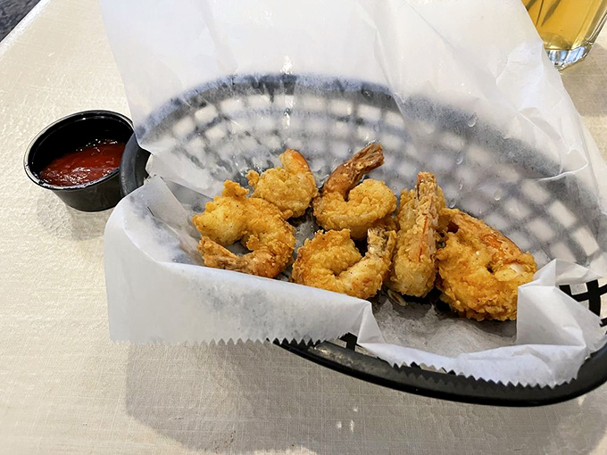 Crispy fried shrimp nestled in paper—nature's perfect food given the Southern treatment. The dipping sauce is just showing off.