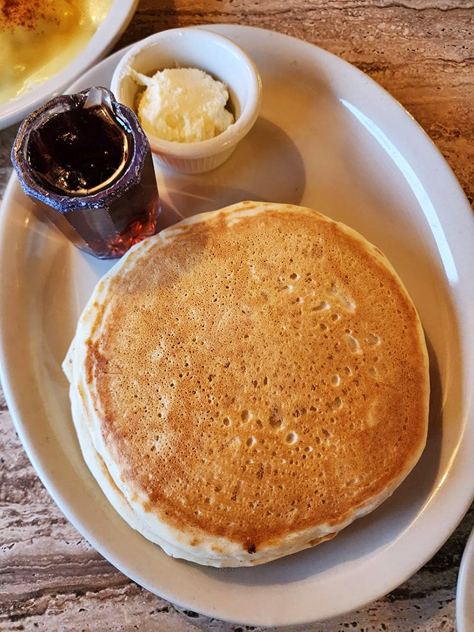 A pancake so perfectly golden it belongs in the breakfast hall of fame. Paired with butter and syrup, it's morning comfort on a plate.