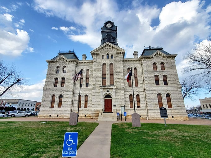 The Granbury Courthouse looks even more impressive against winter skies, with Texas and American flags standing proud like they mean it.