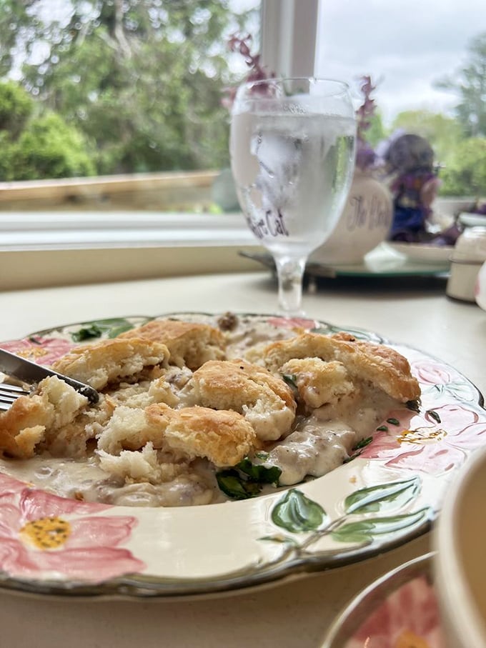 Fluffy biscuits swimming in creamy gravy by a sunlit window&mdash;a Southern classic that proves sometimes the simplest pleasures are the most profound.