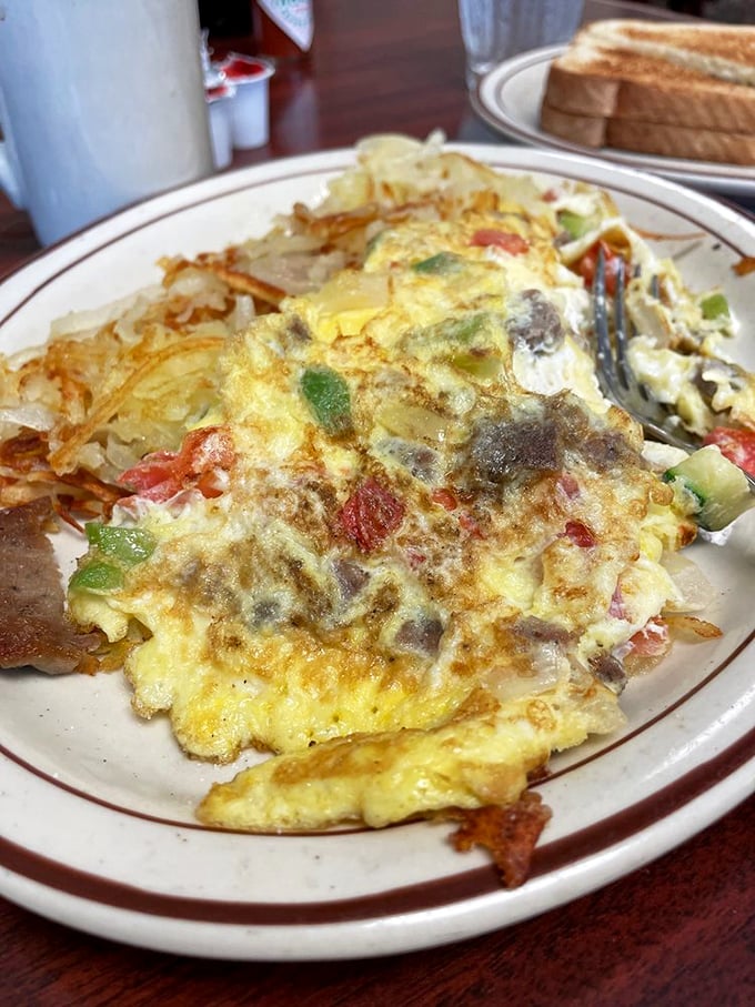 Breakfast gets the Hellenic treatment with this veggie-studded omelet. Hash browns crispy enough to make a potato proud.