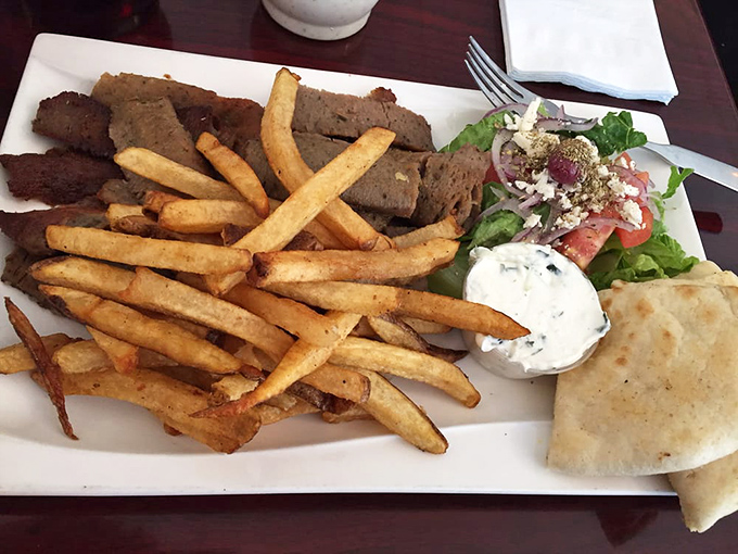 Not just a gyro, but a complete Mediterranean experience &ndash; tender meat, golden fries, fresh salad, and tzatziki that deserves its own fan club.