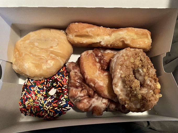 What looks like a modest assortment of donuts is actually an event planner for your taste buds, with glazed, jelly-filled, and chocolate options ready to party.