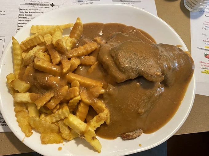 Hot beef sandwich with fries&mdash;the kind of meal that makes you want to call your cardiologist just to brag.