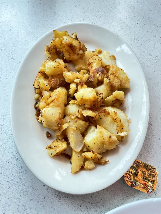 These home fries aren't just a side dish&mdash;they're the supporting actor that steals the show, crispy-edged and seasoned to perfection.