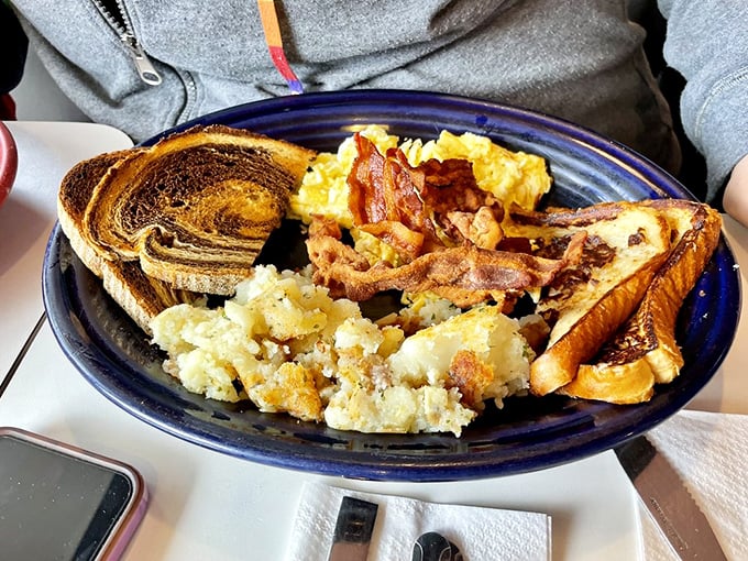 The breakfast plate that launched a thousand satisfied sighs &ndash; eggs, bacon, home fries, and toast in perfect harmony, like the Beatles of breakfast.