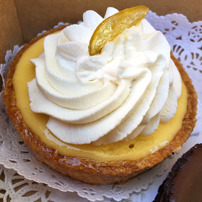 The lemon tart that launched a thousand sighs. That candied lemon slice isn't just garnish&mdash;it's the crown jewel of citrus perfection. 