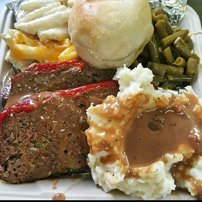 Meatloaf that would make your grandmother simultaneously proud and jealous, smothered in gravy that should be bottled and sold as liquid happiness.
