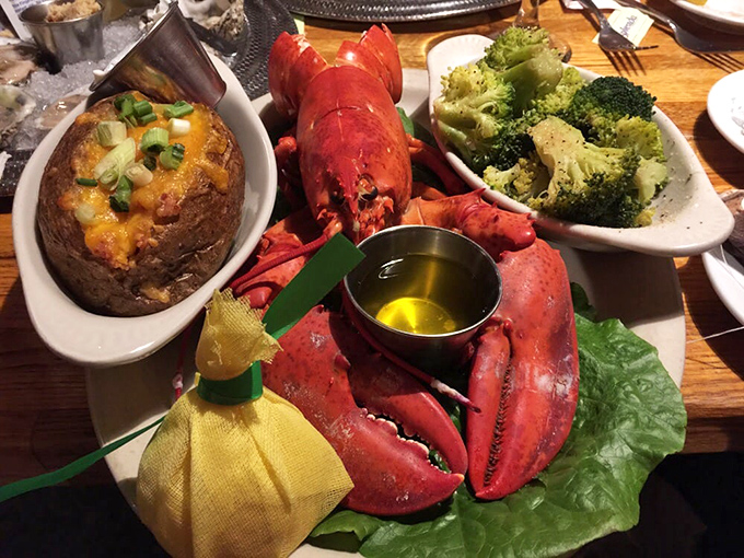 The holy trinity of vacation dining: perfectly steamed lobster, loaded baked potato, and vibrant broccoli that actually makes you want vegetables. 