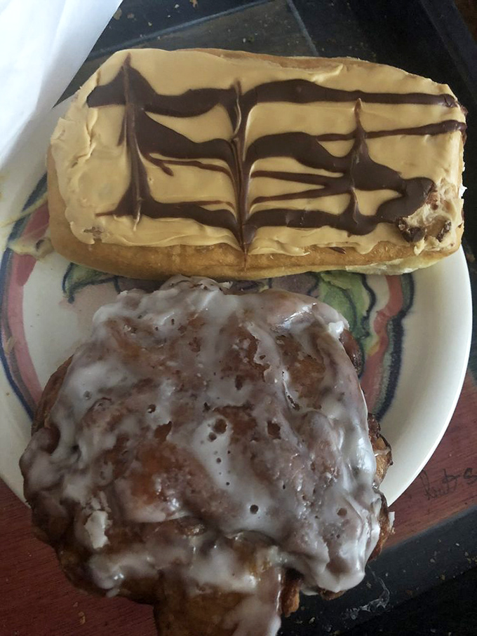 The yin and yang of donut perfection&mdash;an elegant long john with chocolate artistry alongside the beautiful chaos of a glazed fritter.
