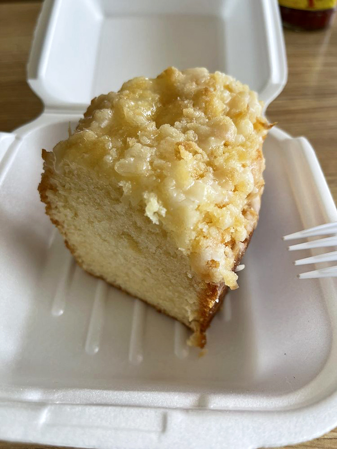 This slice of Louisiana Sweet Cake isn't just dessert—it's the kind of buttery, crumbly perfection that makes you contemplate ordering a whole cake "for later."