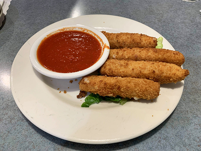 Golden-brown mozzarella sticks with that perfect pull-apart cheese stretch – the universal language of comfort food that needs no translation.