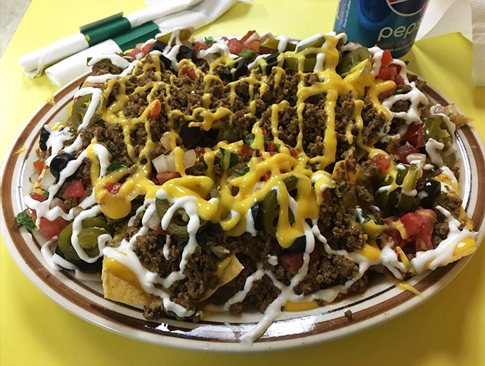Loaded nachos that require a strategic eating plan. Every chip is a little landscape of flavor with valleys of cheese and mountains of seasoned beef.