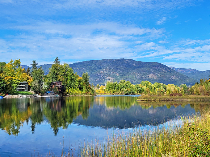 Technicolor autumn reflections double the visual bang for your retirement buck on Sandpoint's tranquil waters.