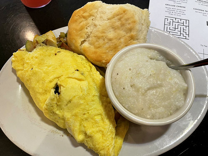 This fluffy omelet with a side of grits and biscuit isn't just breakfast&mdash;it's edible Southern hospitality on a plate.