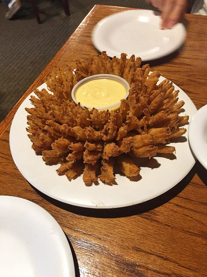 The "bloomin' onion" – nature's edible flower that proves vegetables can be decadent when properly introduced to hot oil and seasoning.
