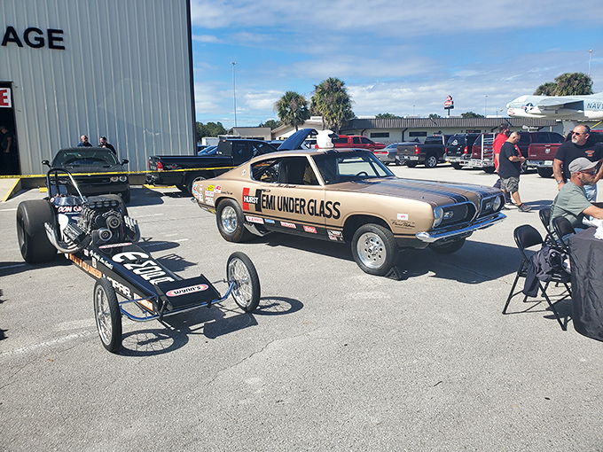 When dragsters venture outdoors&mdash;a rare sight, like seeing nocturnal creatures in daylight. The Plymouth's "Team Under Glass" livery gleams in Florida sunshine.