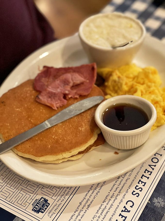 The pancake trinity: fluffy hotcakes, golden home fries, and country ham&mdash;proof that breakfast is the most important art form of the day.