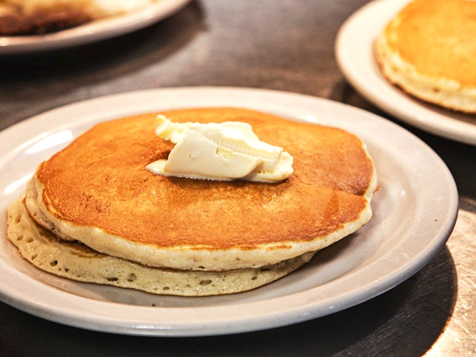 Golden pancakes with a pat of butter slowly melting into their fluffy embrace &ndash; breakfast's version of a warm hug. 