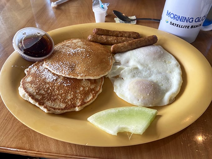 The breakfast trinity: golden pancakes, perfectly cooked eggs, and sausage links. Simple? Yes. Basic? Never. This is breakfast fundamentals executed with reverence.