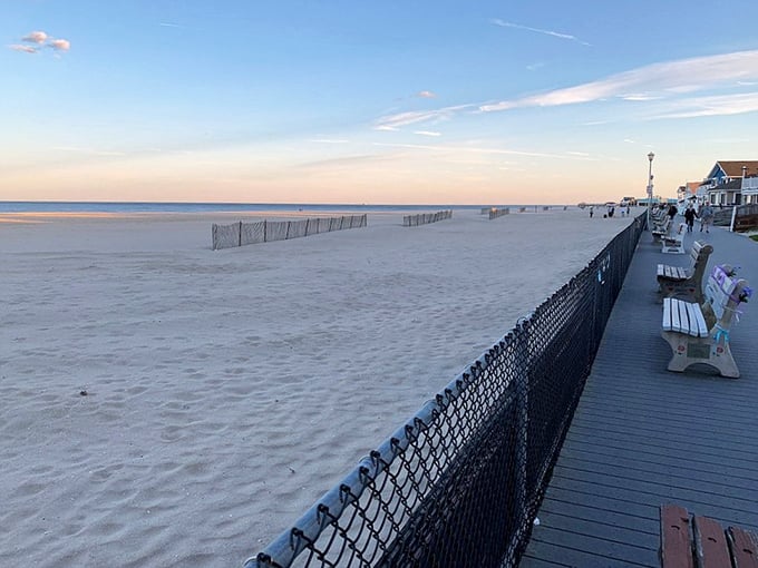 Sunset paints Point Pleasant Beach in golden hues as the boardwalk benches offer front-row seats to nature's nightly masterpiece. Better than any Broadway show.