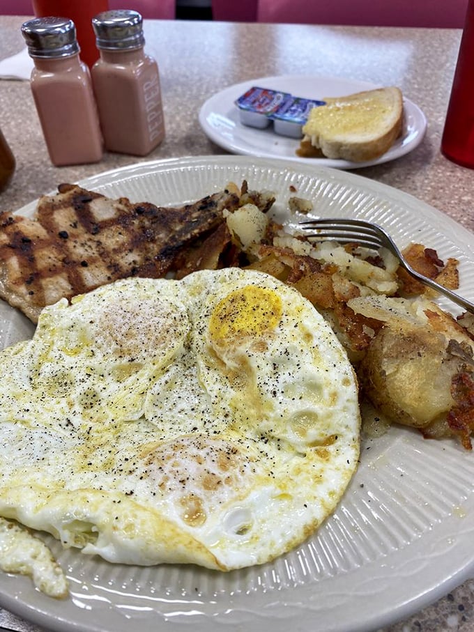 French toast that's had a proper education &ndash; crisp edges, custardy center, and a dusting of powdered sugar that would make a pastry chef weep.