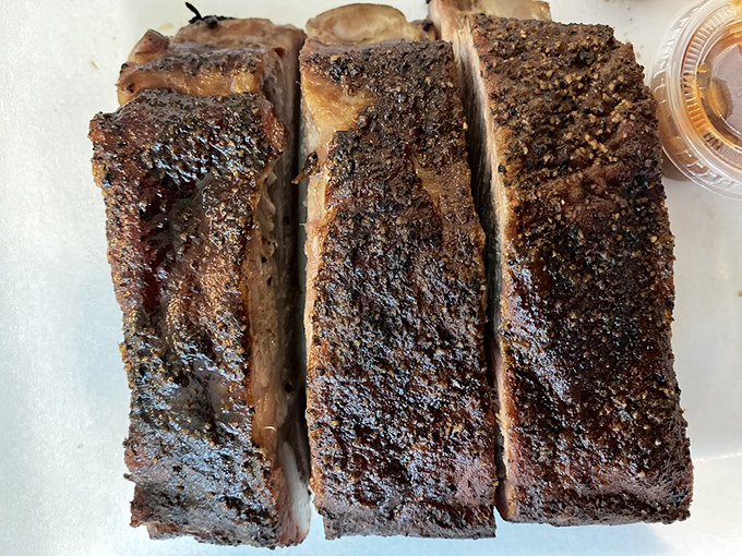 The bark on these ribs is like nature's candy&mdash;a peppery, caramelized crust protecting meat that's tender without falling apart at first touch.