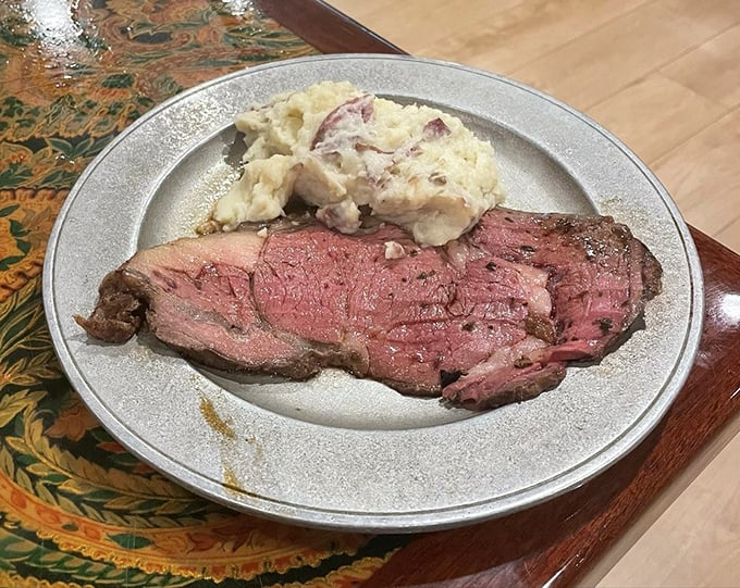 Prime rib so perfectly pink it could make a vegetarian question their life choices, paired with potatoes that scream comfort.