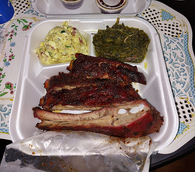 When your barbecue comes in a humble styrofoam container, you know you're in the right place. Those mustard greens aren't playing second fiddle to anyone.