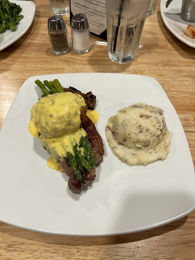 When a steak arrives this perfectly medium-rare, there's a moment of reverent silence before the first bite – like witnessing a sunset over the Blue Ridge.