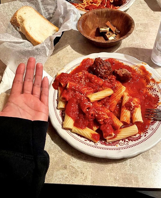 Rigatoni tubes: nature's perfect sauce delivery system. Each ridged cylinder captures the perfect amount of that century-old tomato magic.