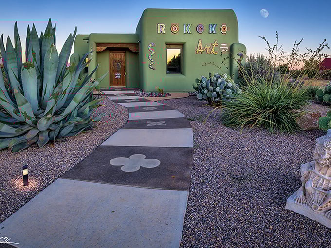 Rokoko Art Gallery emerges from the desert like a vibrant mirage, where cacti stand guard over colorful treasures within.