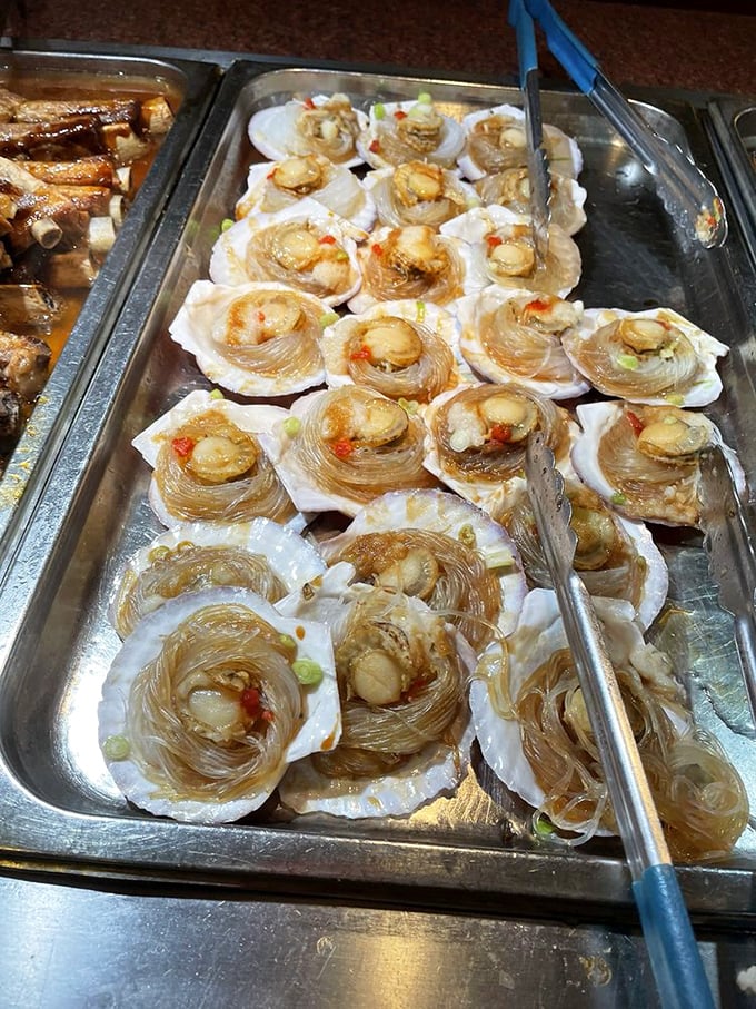 These scallops nestled in glass noodles are the buffet equivalent of finding an unexpected twenty in your winter coat&mdash;a delightful surprise worth savoring. 