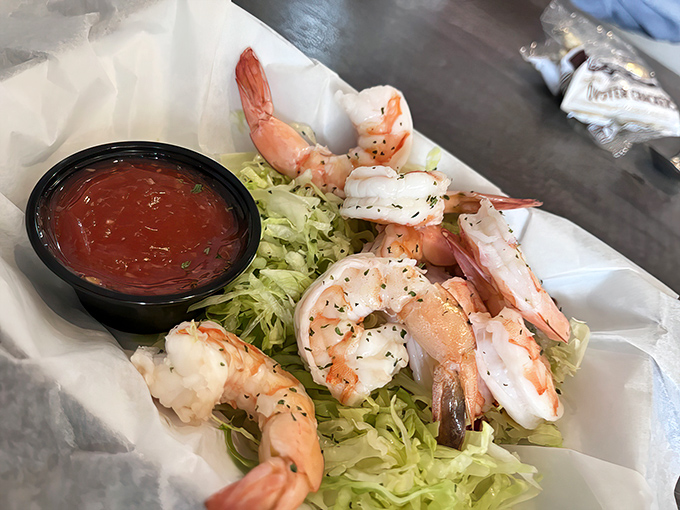 Plump shrimp perched on a bed of lettuce, just waiting for their cocktail sauce bath. Simple, classic, and utterly irresistible.