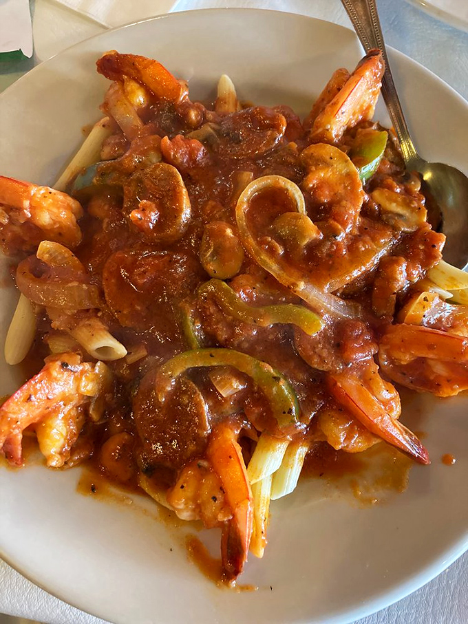 When seafood meets marinara with peppers and onions, it's like an Italian symphony where every ingredient gets its solo moment.