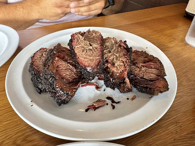 Brisket sliced thick with that telltale pink smoke ring&mdash;the barbecue equivalent of a Rolex watch. Proof that patience and smoke create magic.