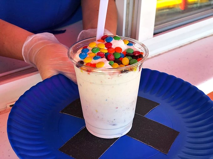 M&Ms sprinkled like confetti on soft serve&mdash;proof that sometimes the best parties happen in a plastic cup.