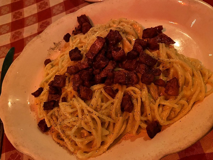 Carbonara that would make Romans nod in approval. Those crispy pancetta cubes aren't just toppings&mdash;they're little flavor bombs waiting to detonate on your palate.