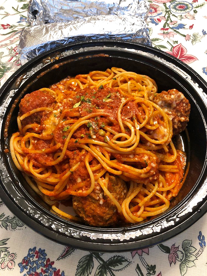 Spaghetti and meatballs in their natural habitat – swimming in rich tomato sauce, ready to transport you to Sunday dinners you wish you'd had.