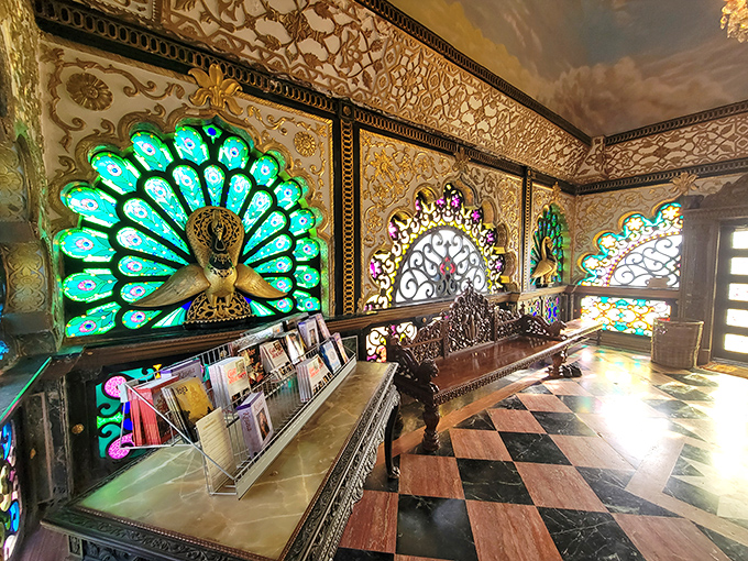 Stained glass peacock designs transform ordinary sunlight into a kaleidoscope of colors. Whoever said "less is more" clearly never visited this place.