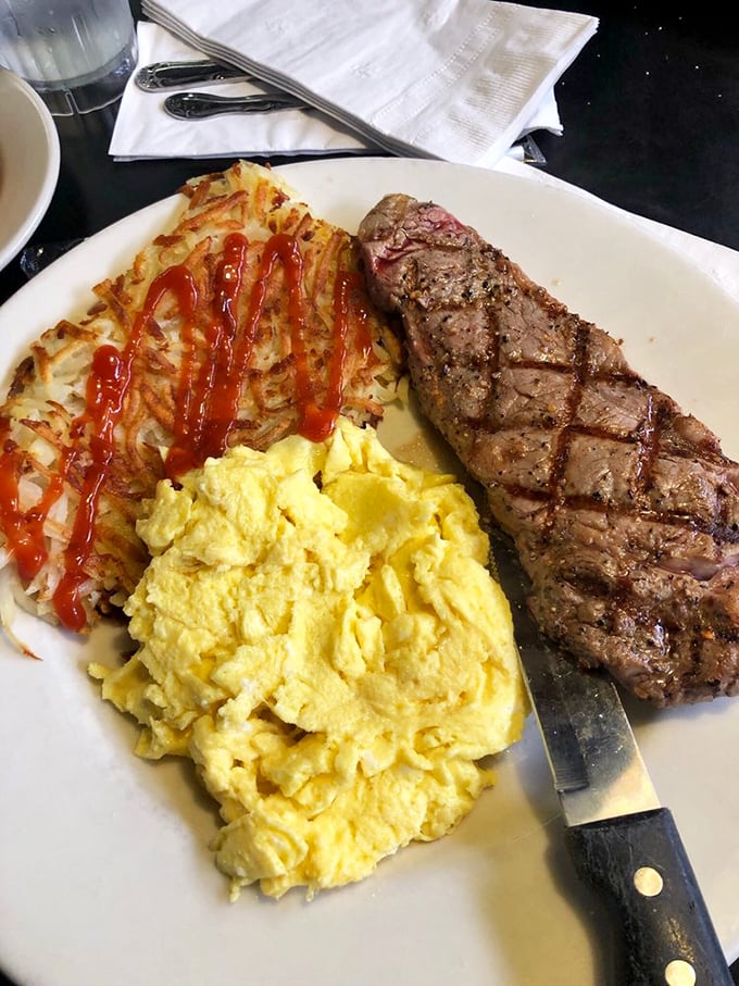The holy trinity of breakfast: perfectly medium steak, cloud-like scrambled eggs, and those hash browns that haunted my dreams.