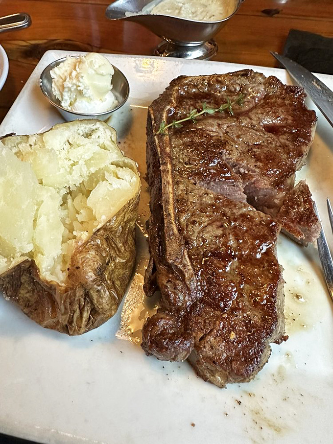 This strip steak has the kind of mahogany crust that would make furniture makers jealous. The baked potato stands by like a faithful sidekick.