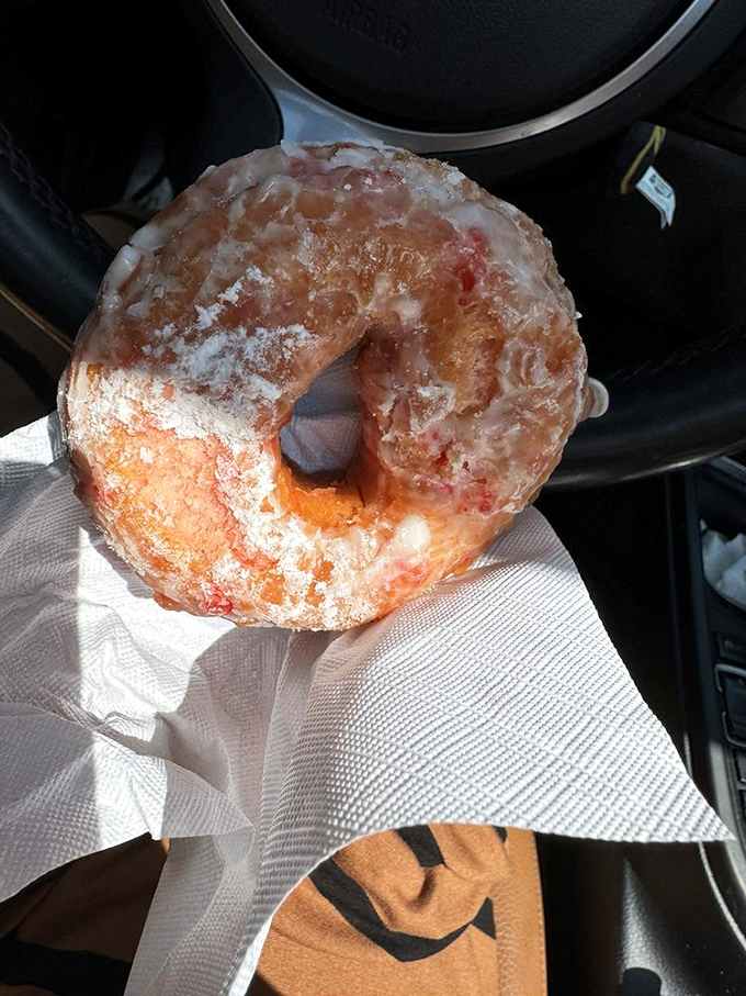 Evidence of a crime scene: donut homicide. That bite mark represents the moment willpower crumbled in the face of strawberry-glazed perfection.