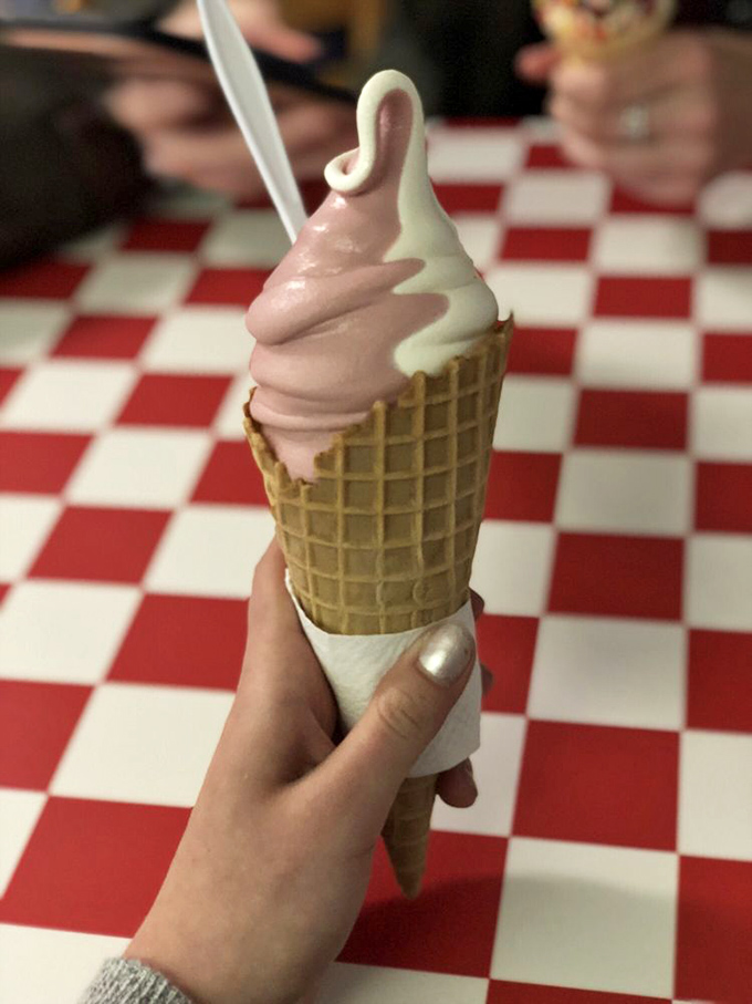 Pink and white swirled perfection. This cone isn't just dessert&mdash;it's what summer memories are made of, one lick at a time.