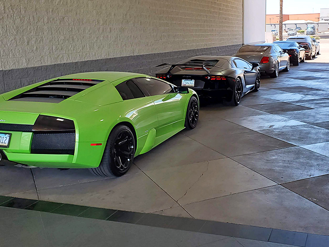 Exotic supercars line up like candy in a very expensive vending machine. The kind of eye candy that makes grown adults press their noses against windows.